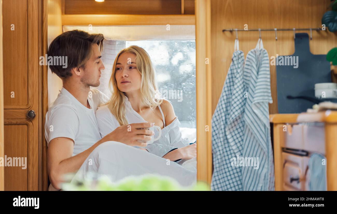 Young just married couple traveling in camper,house on wheels,trailer ...