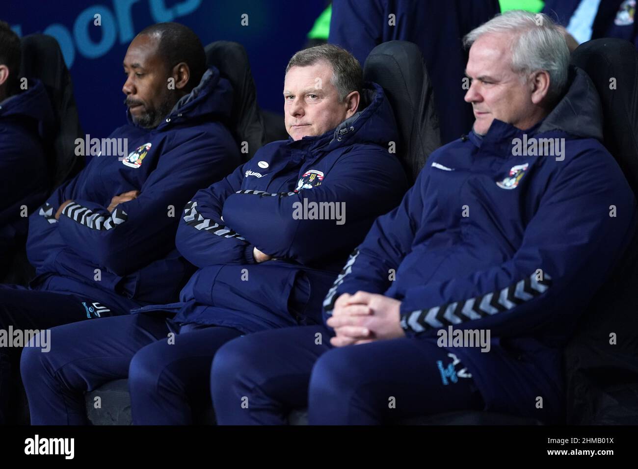 Coventry City staff Dennis Lawrence, manager Mark Robins and Adi ...
