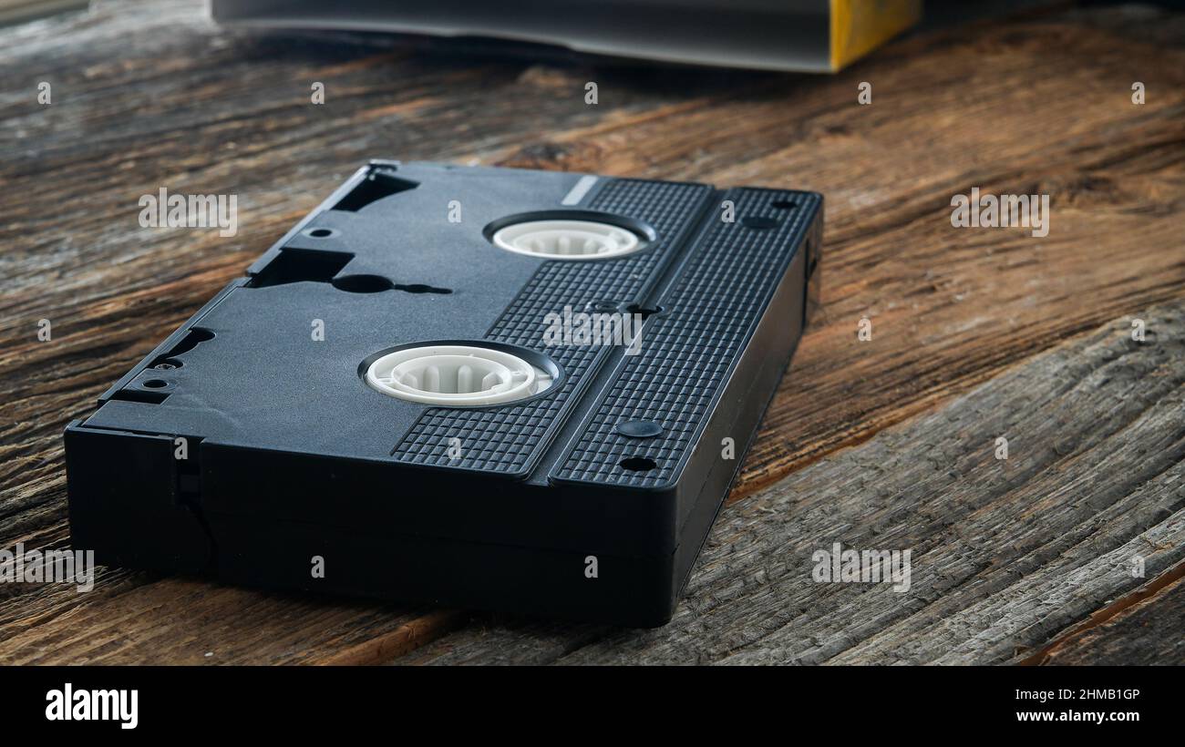 VHS video tape on rustic wooden table Stock Photo - Alamy