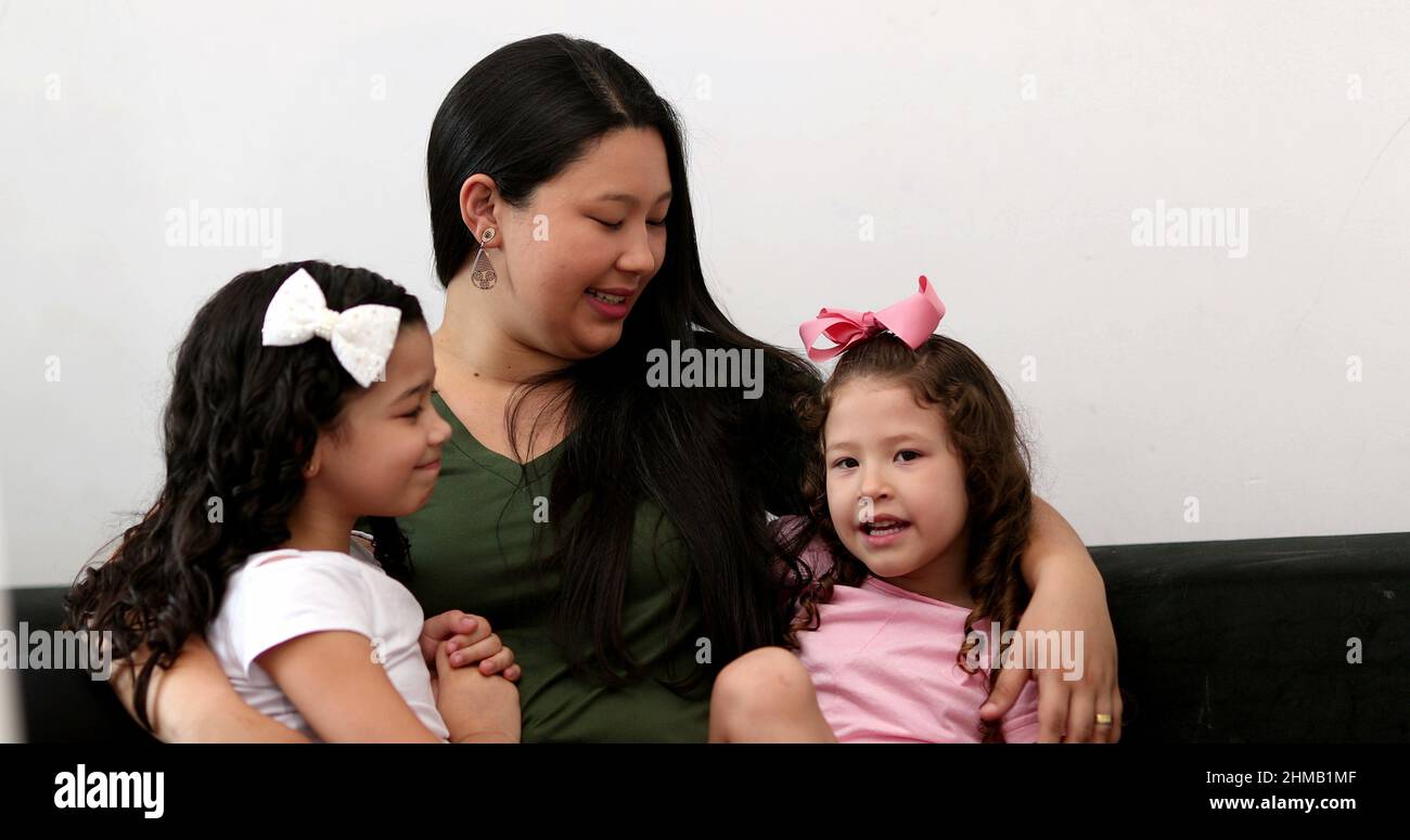 Asian mom with hispanic mix children interaction Stock Photo - Alamy