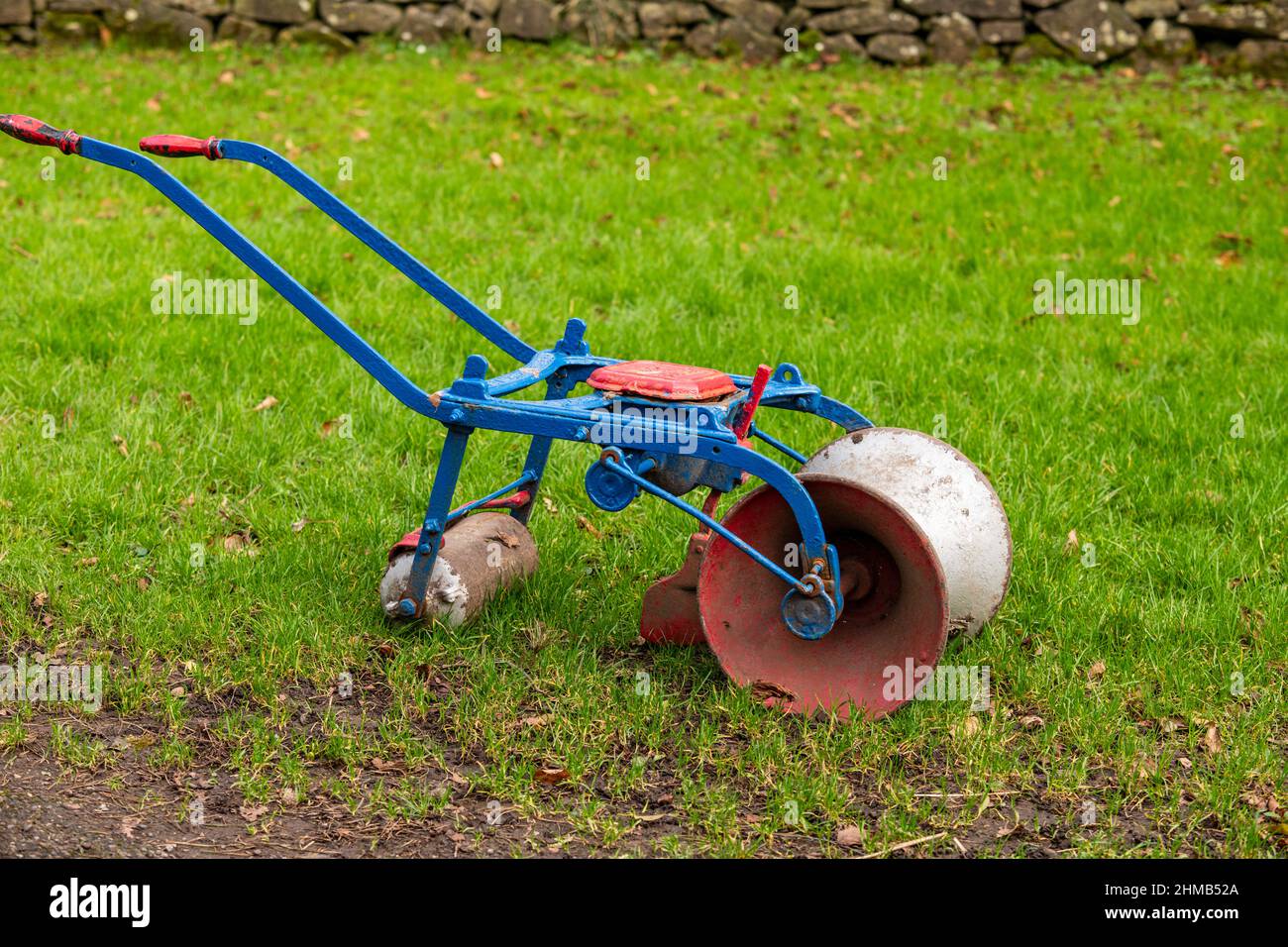 Old farm machinery on display for viewers at park Stock Photo - Alamy
