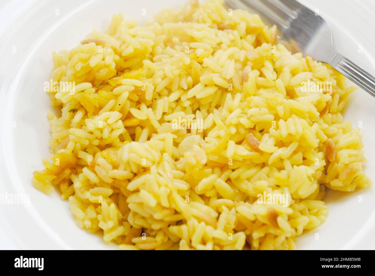 Bowl of Herb and Yellow Rice Stock Photo - Alamy