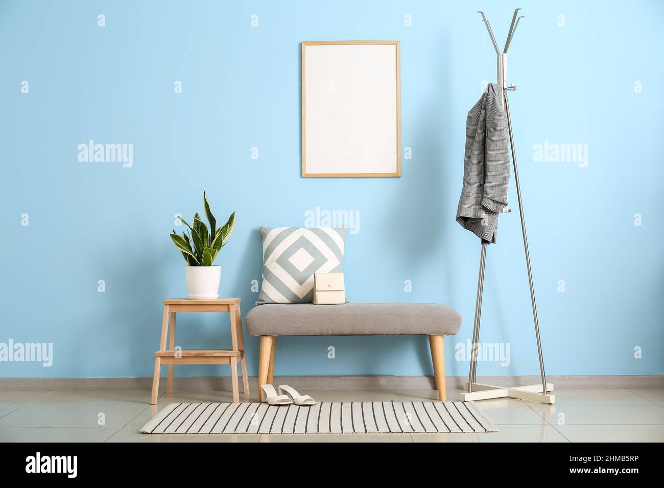 Interior of stylish hall with step stool, bench and rack Stock Photo ...