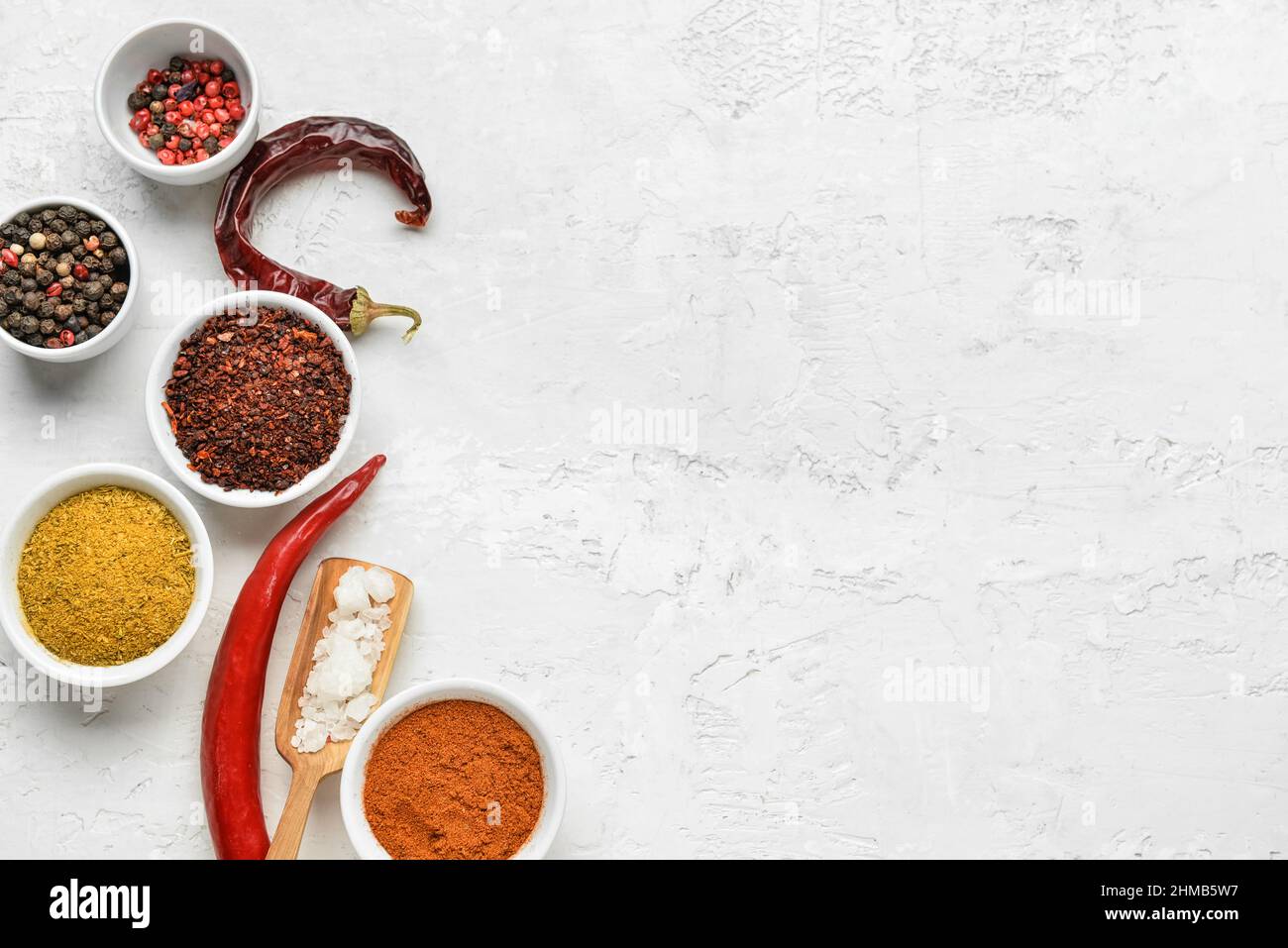 Set of different spices on light background Stock Photo - Alamy