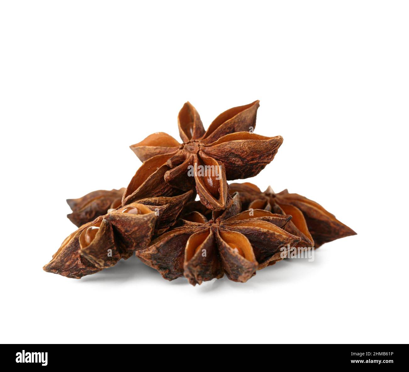 Heap of anise stars on white background Stock Photo - Alamy