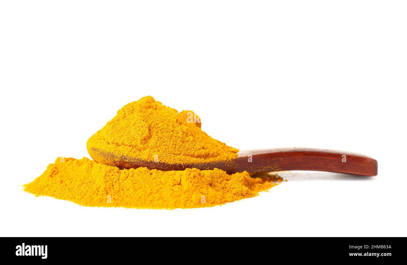 Spoon with turmeric powder isolated on white background Stock Photo - Alamy