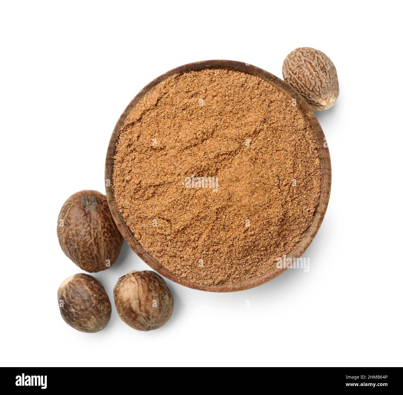 Bowl of nutmeg powder and nuts on white background Stock Photo - Alamy