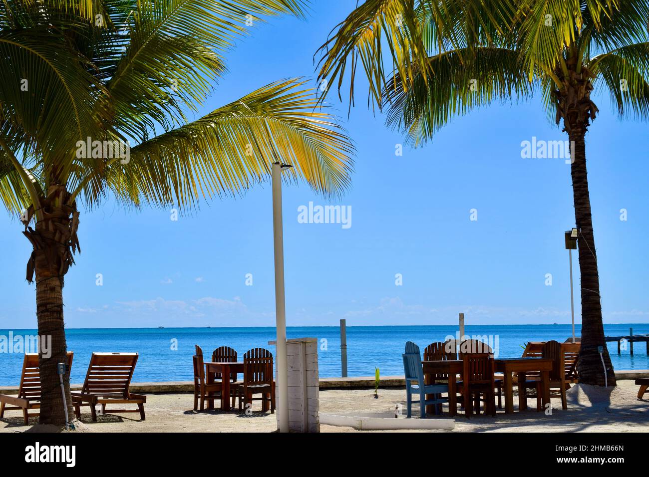 Outdoor dining and relaxation area with tables, chairs, and lounge ...