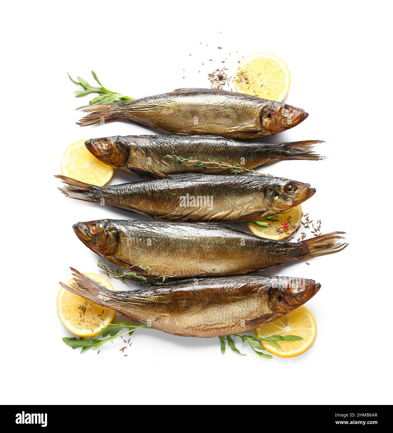 Smoked herring fishes on white background Stock Photo - Alamy