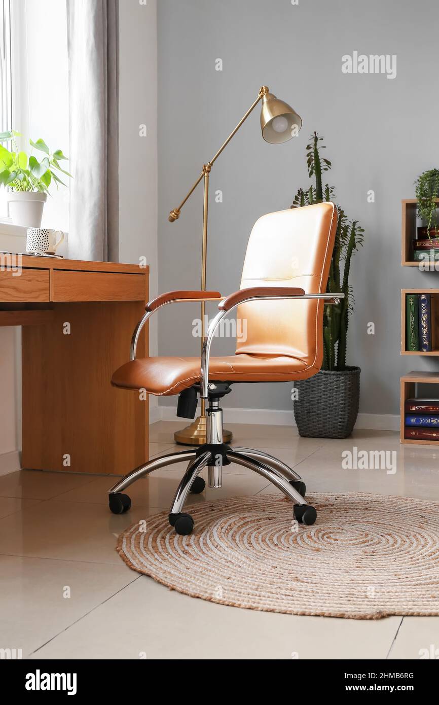 Stylish office chair in interior of modern room Stock Photo - Alamy