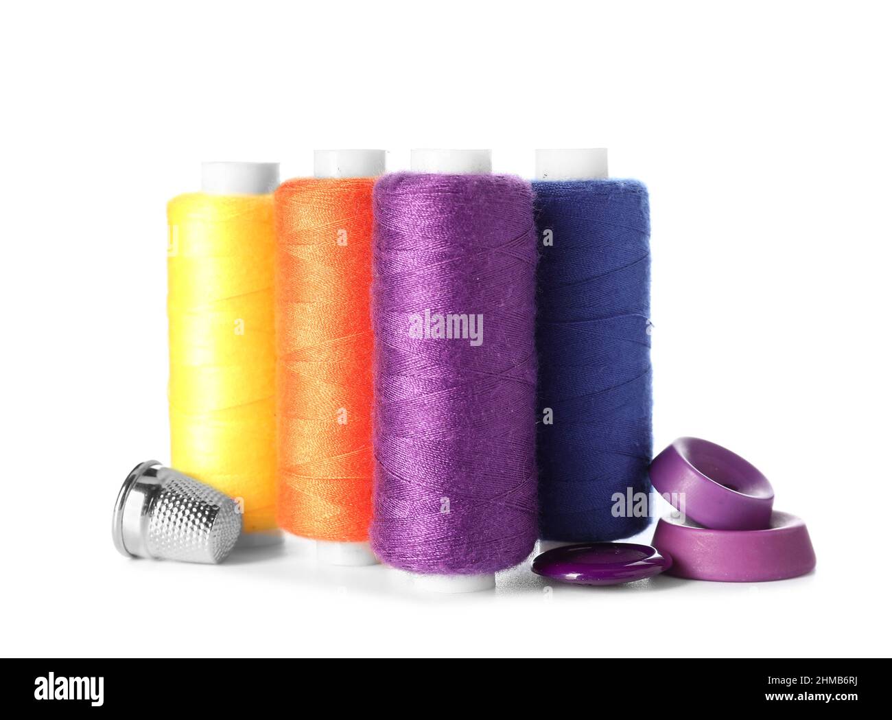 Sewing threads with measuring tape on white background Stock Photo - Alamy