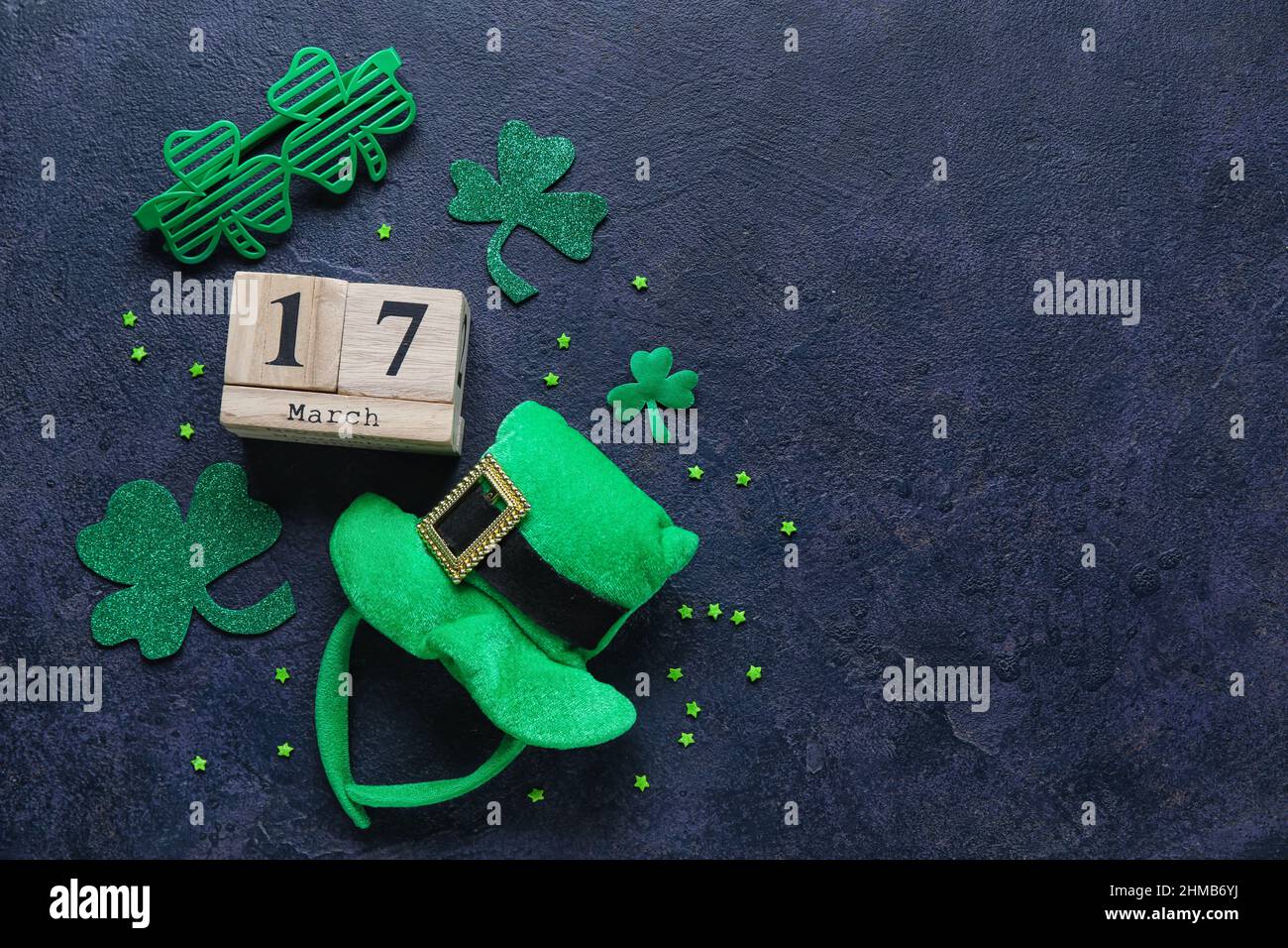 Leprechaun hat, clover leaves and calendar with date of St. Patrick's ...