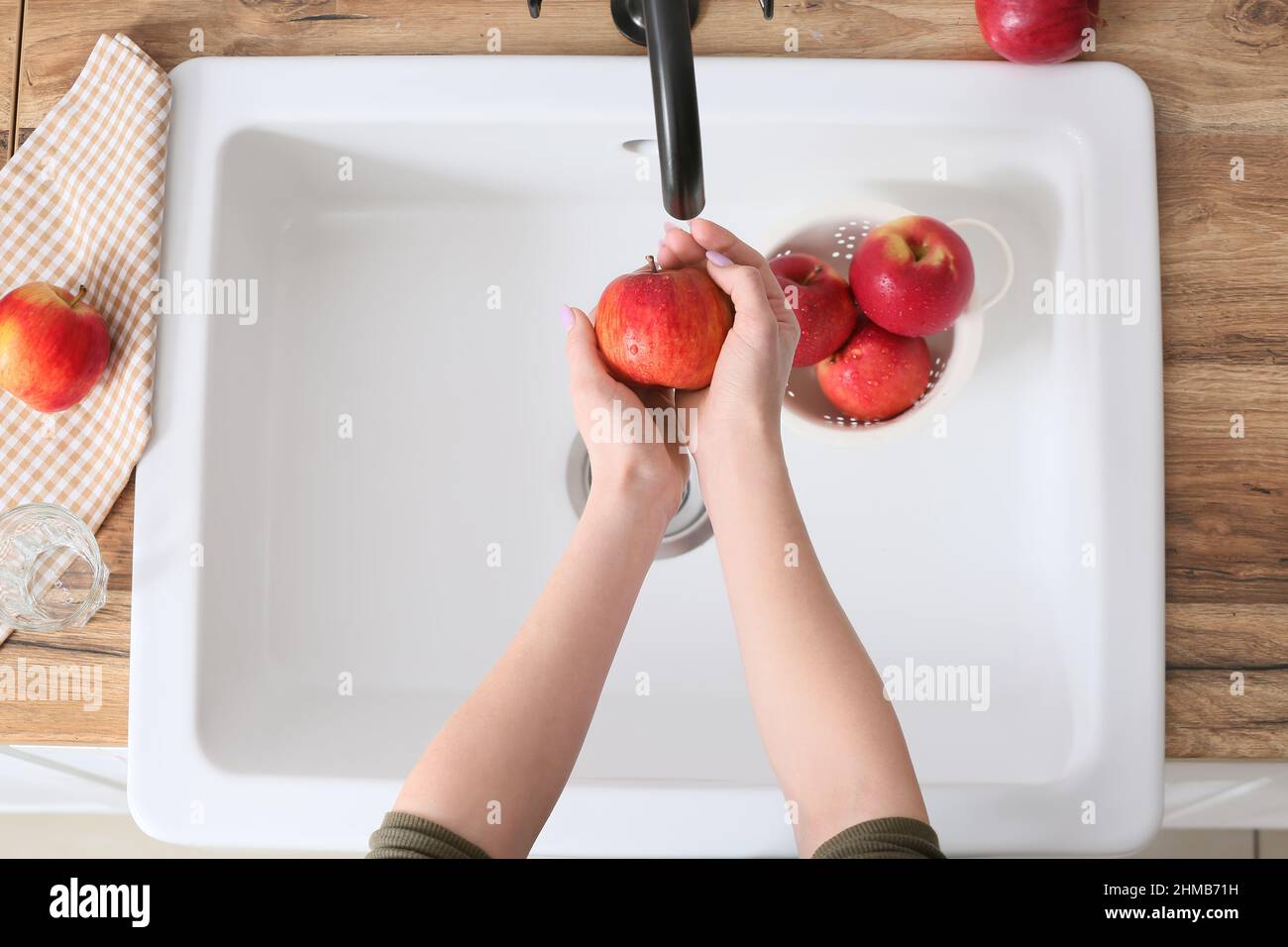 Woman hands wash apple hi-res stock photography and images - Alamy