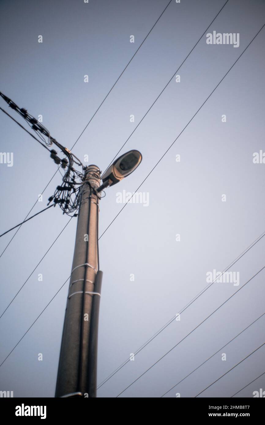 Street electric pole with a lamp and lot of wires Stock Photo - Alamy