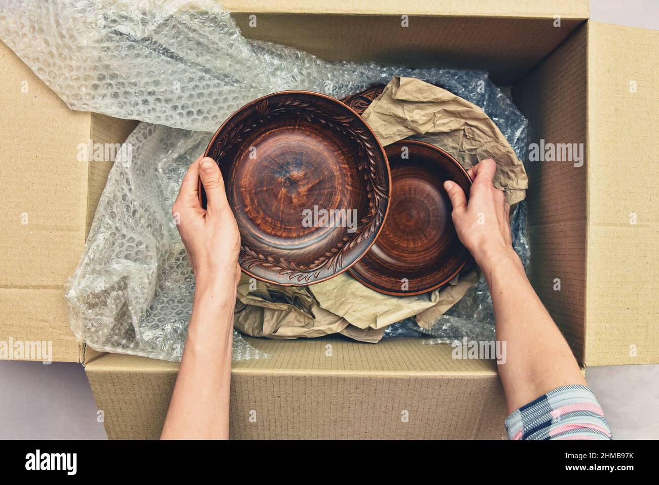 Delivery package of goods dishes in a cardboard box top view Stock ...