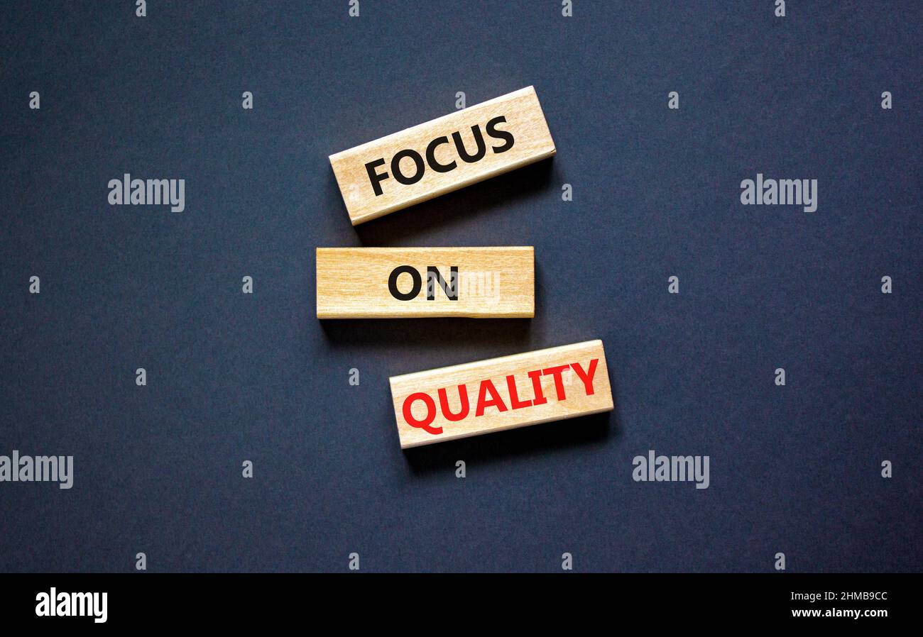 Focus on quality symbol. Concept words Focus on quality on blocks on ...