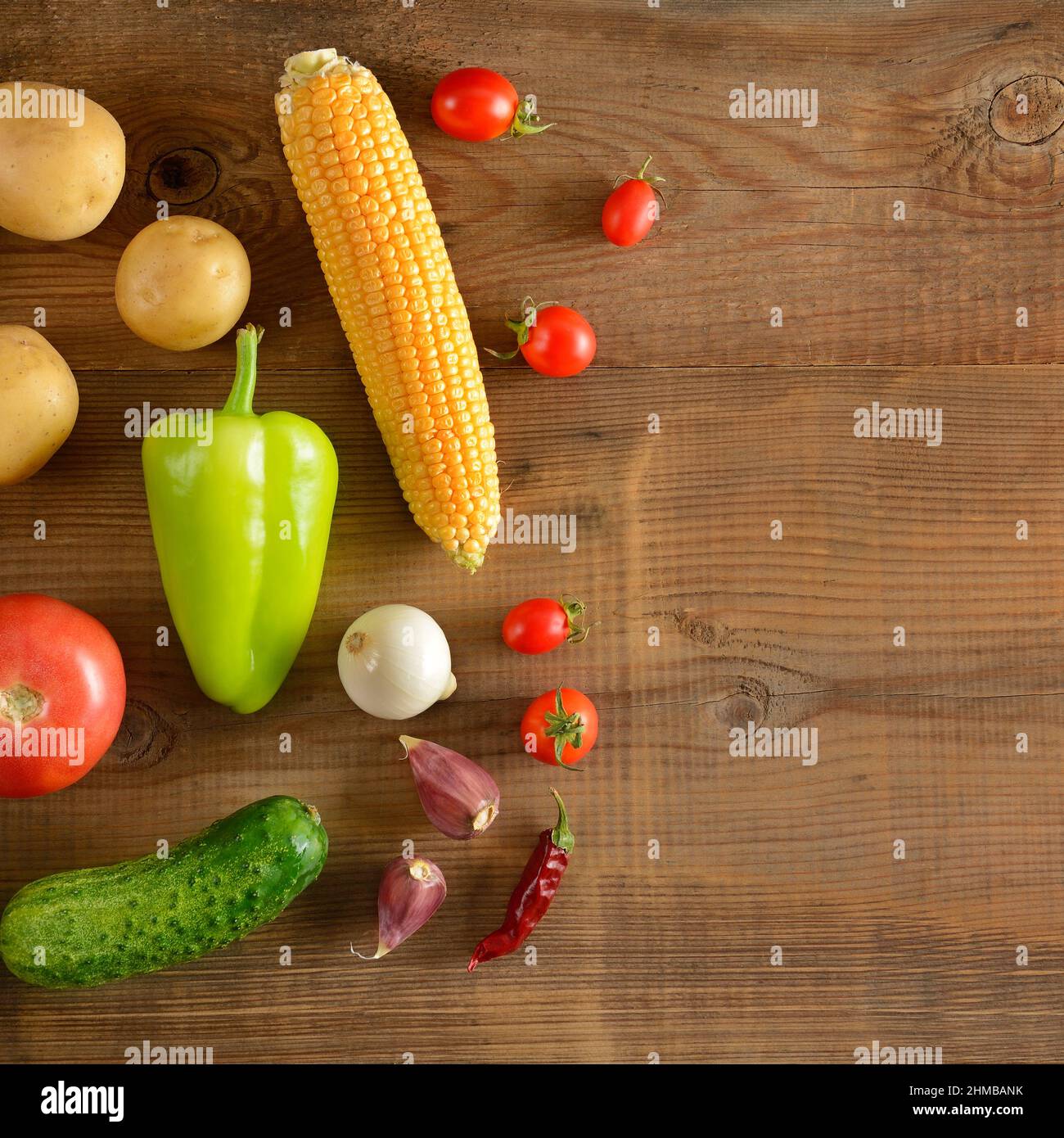A set of vegetables laid out on a wooden table. Flat lay,top view. Free ...