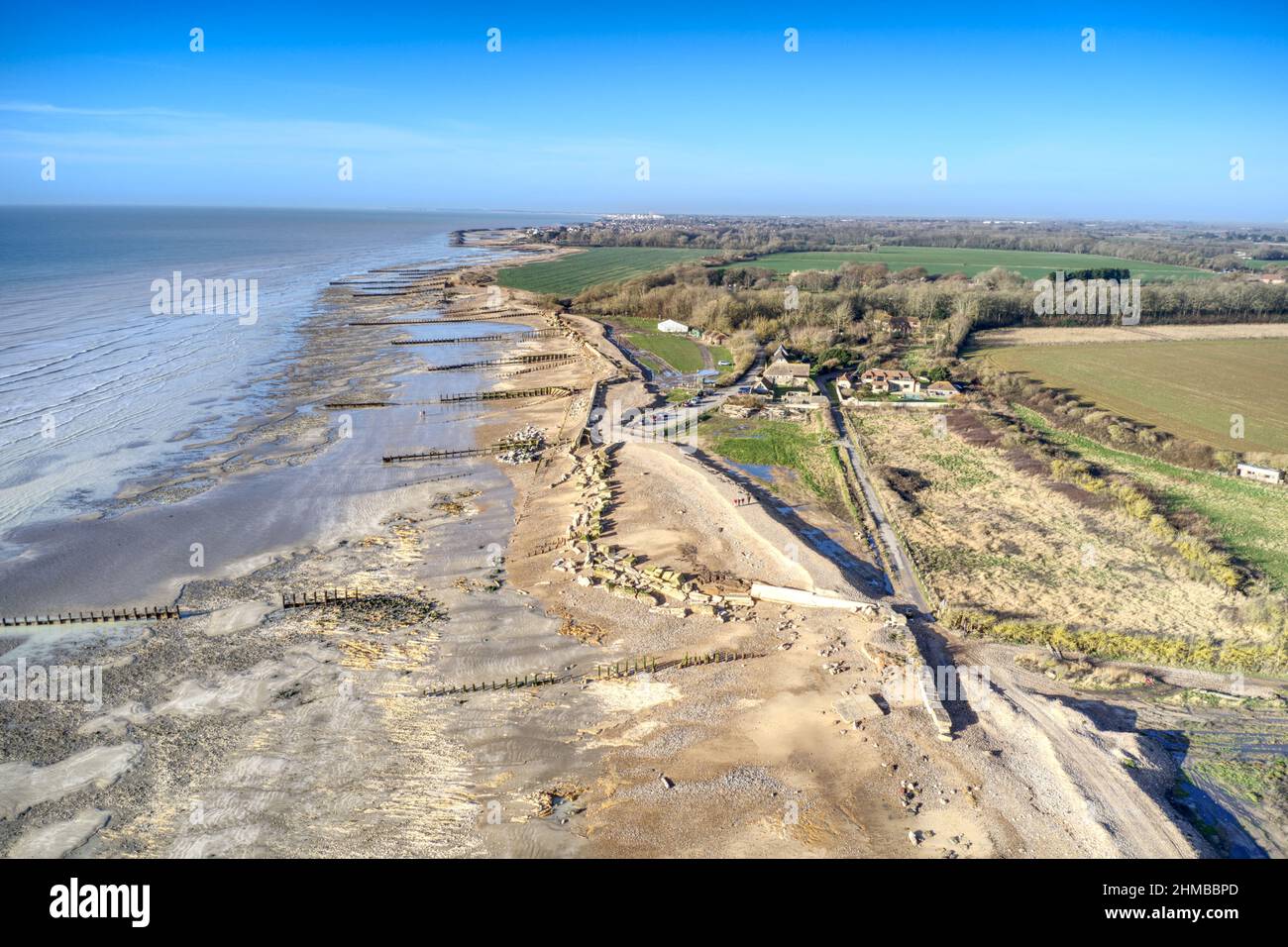 Climping Beach in West Sussex and broken wooden groynes at low tide ...