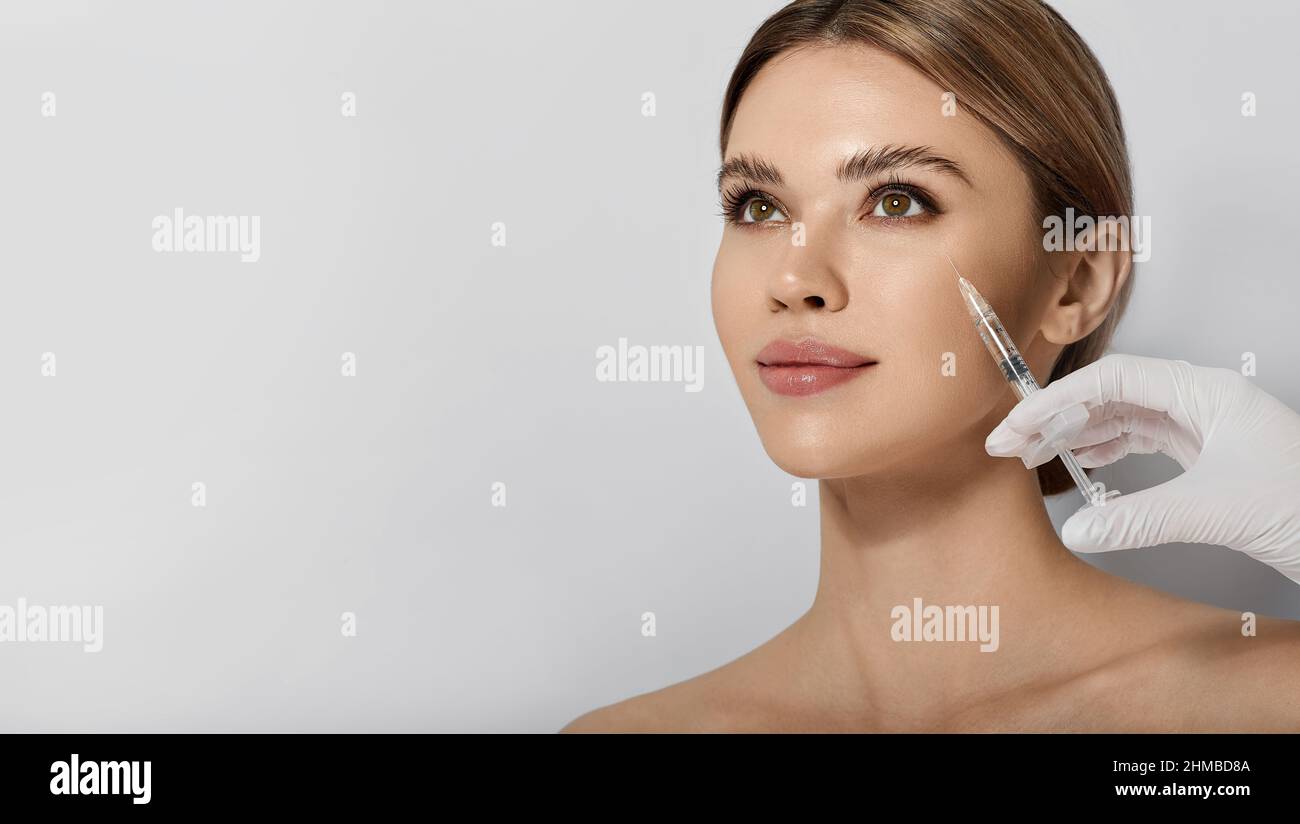 Beautiful woman receives anti wrinkle beauty injection for facial ...