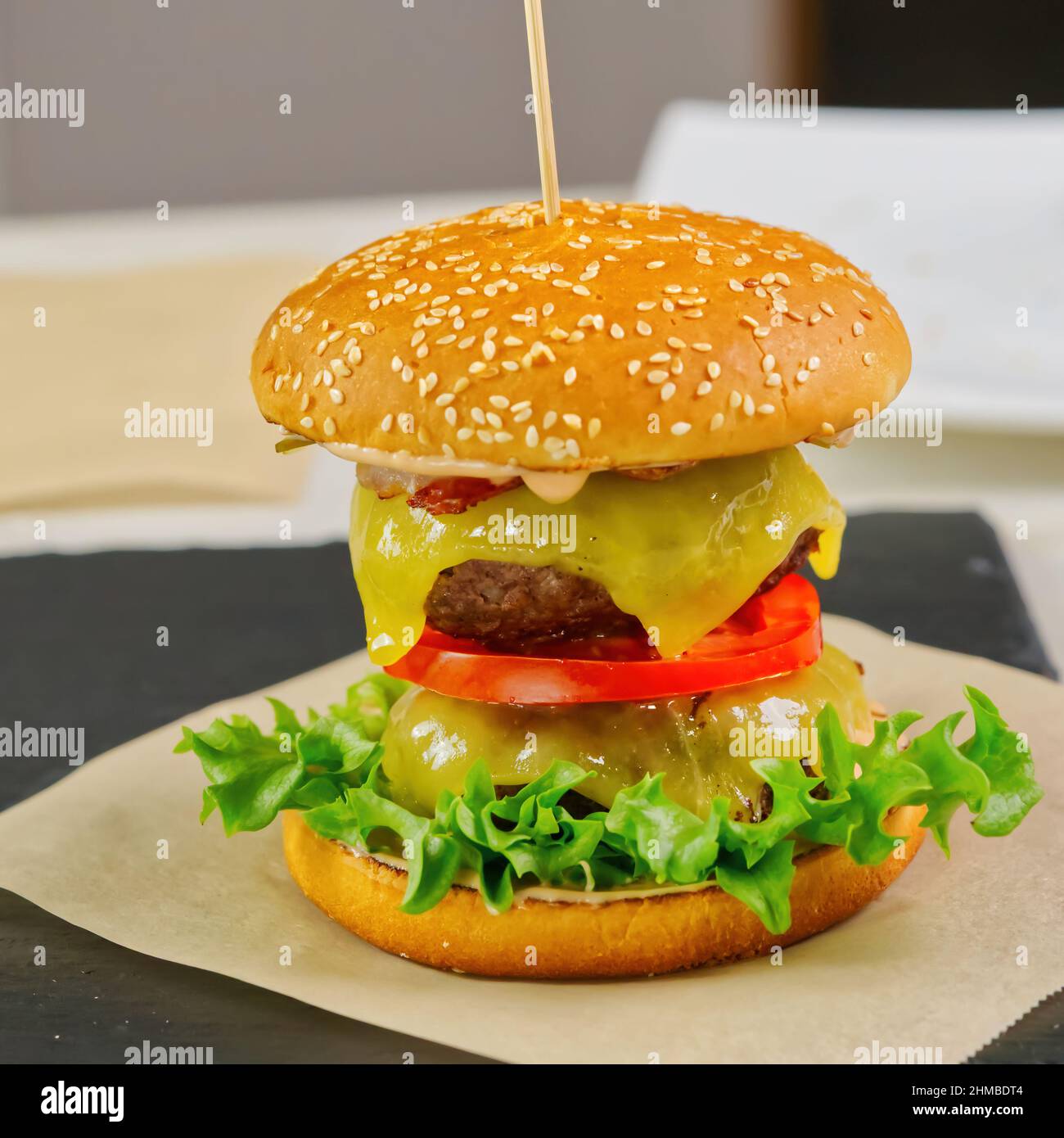 Big double burger on black stone plate. homemade cheeseburger Stock ...