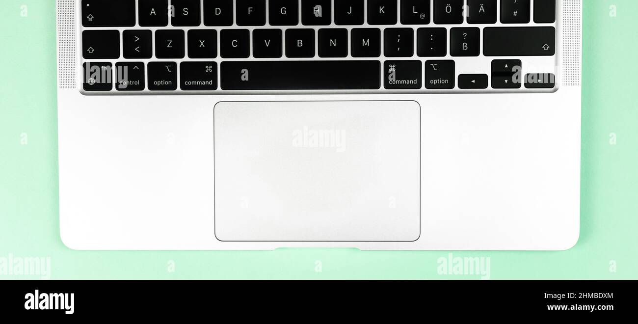 Modern laptop keyboard flat lay bright banner background. Office ...