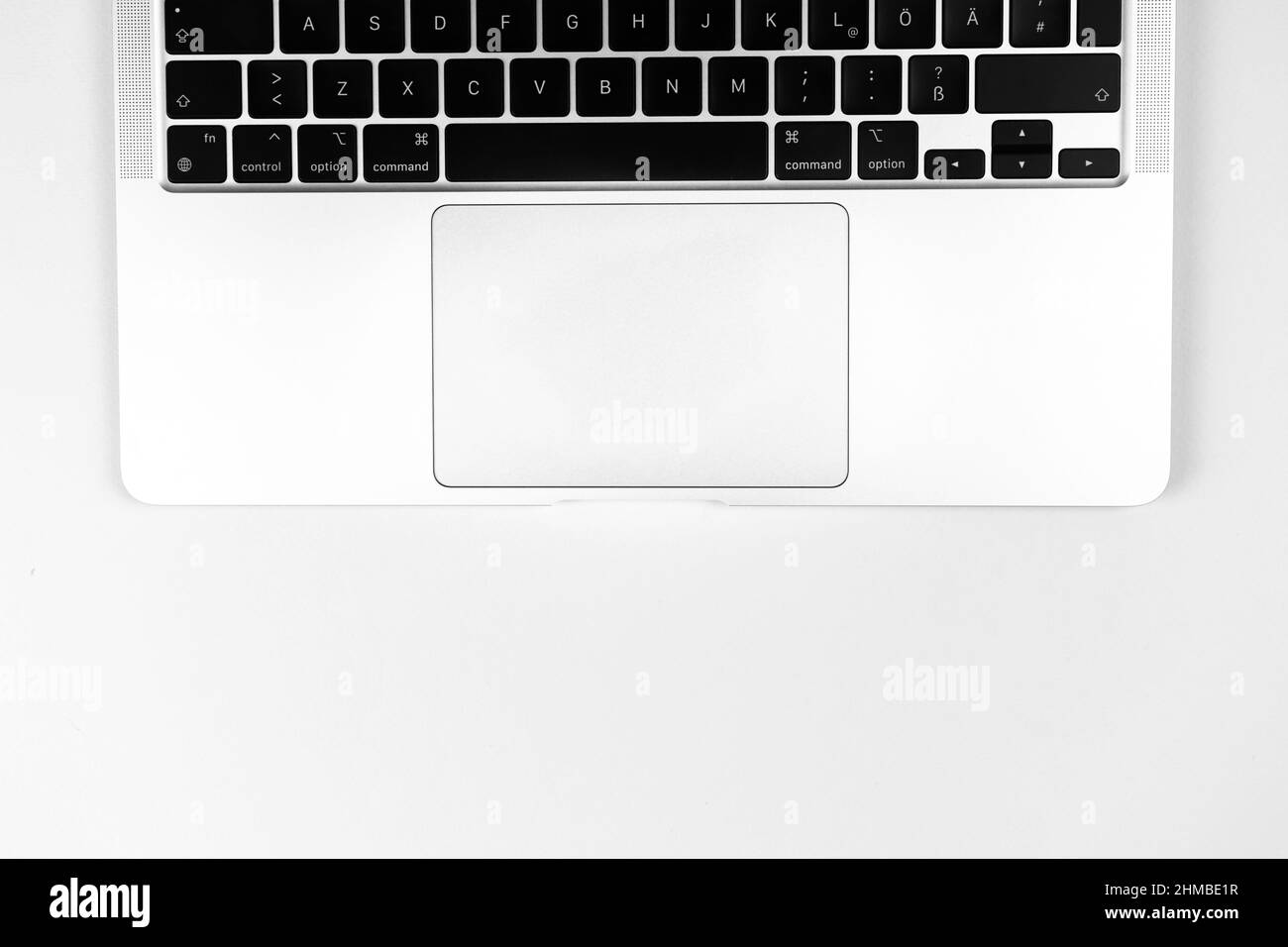 Modern laptop keyboard flat lay silver background. Office workplace ...