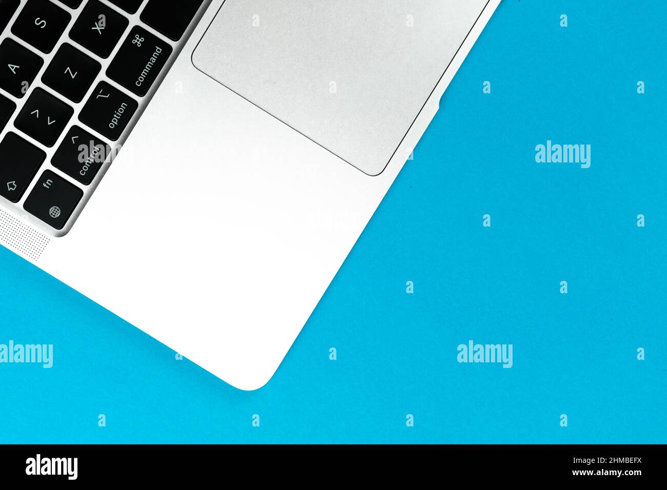 Laptop flat lay blue background. Office workspace table, minimal design ...