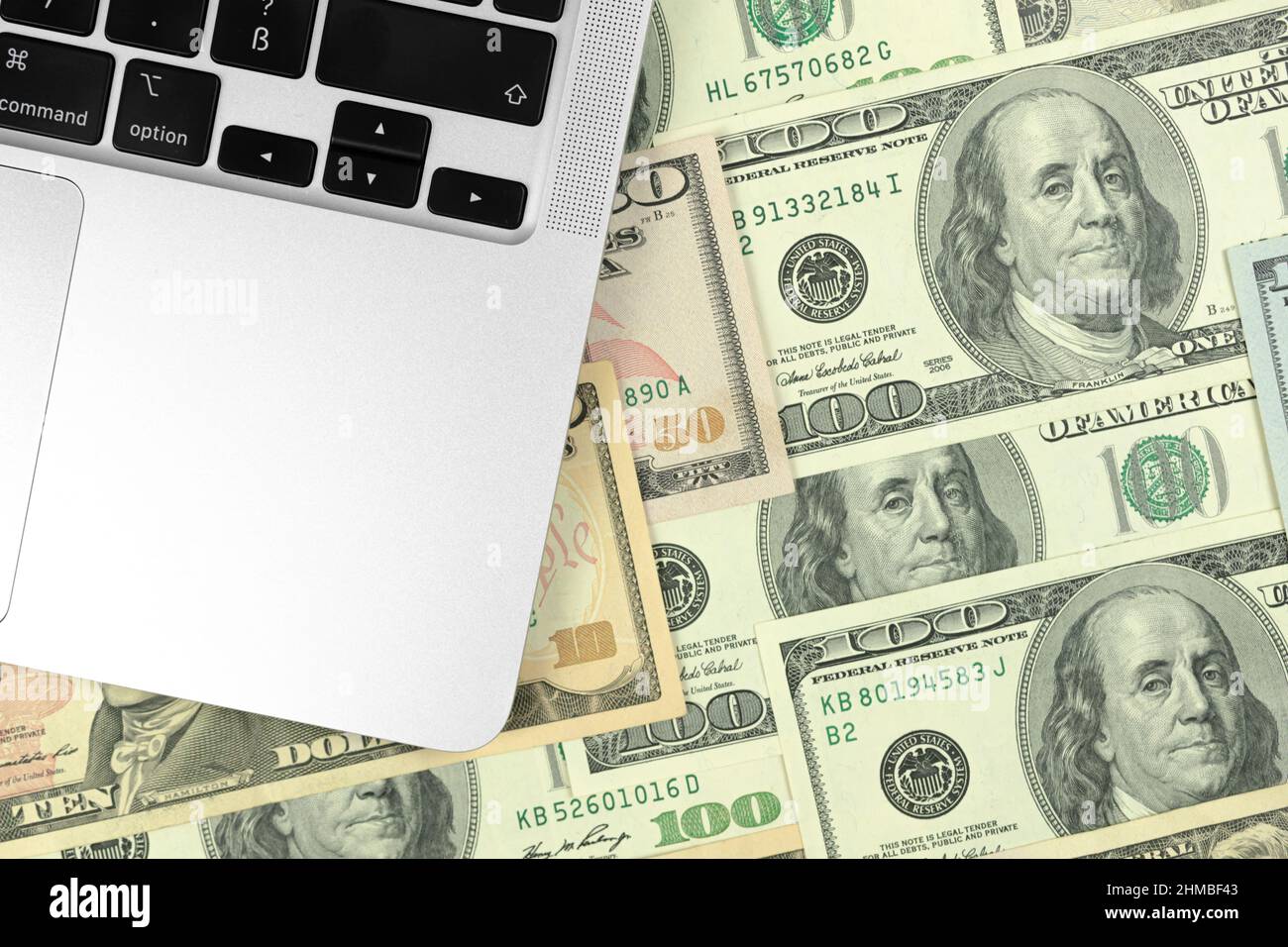 Laptop flat lay and money background. Business office workplace table ...