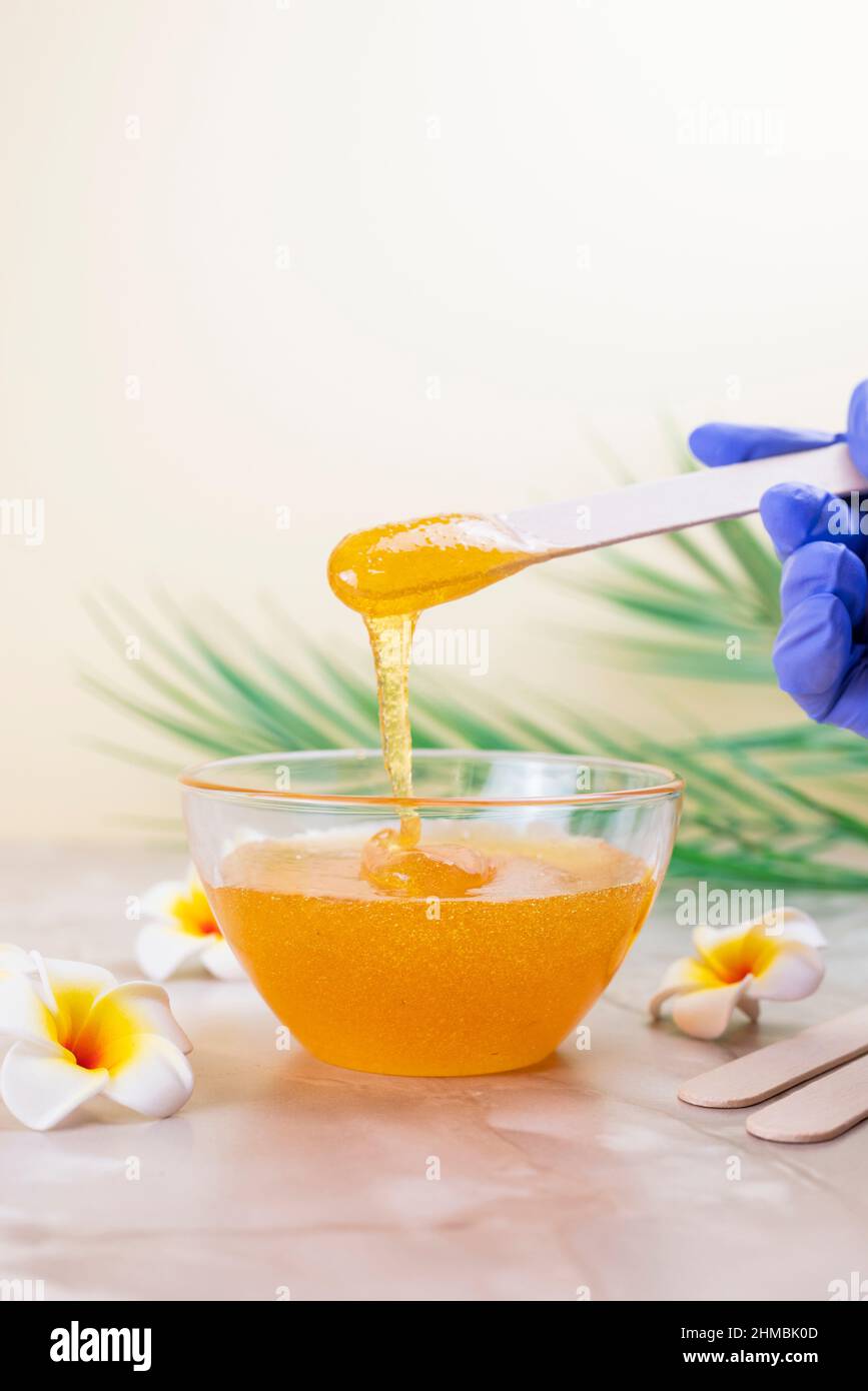sugar paste for depilation shugaring with mango flower Stock Photo - Alamy