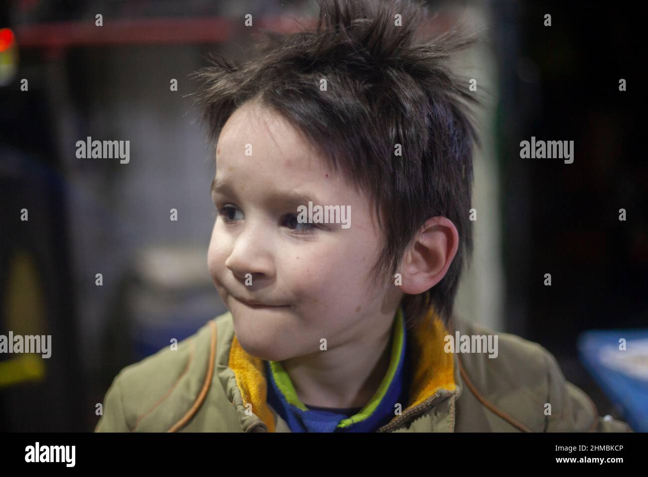 Portrait of a cheerful grimy boy. Close-up shot of a child. The face of ...