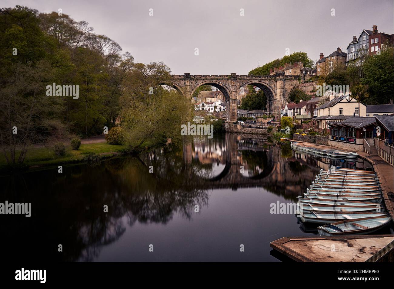 Beautiful view of the Nidd river, the old bridge, and rowing boats from ...