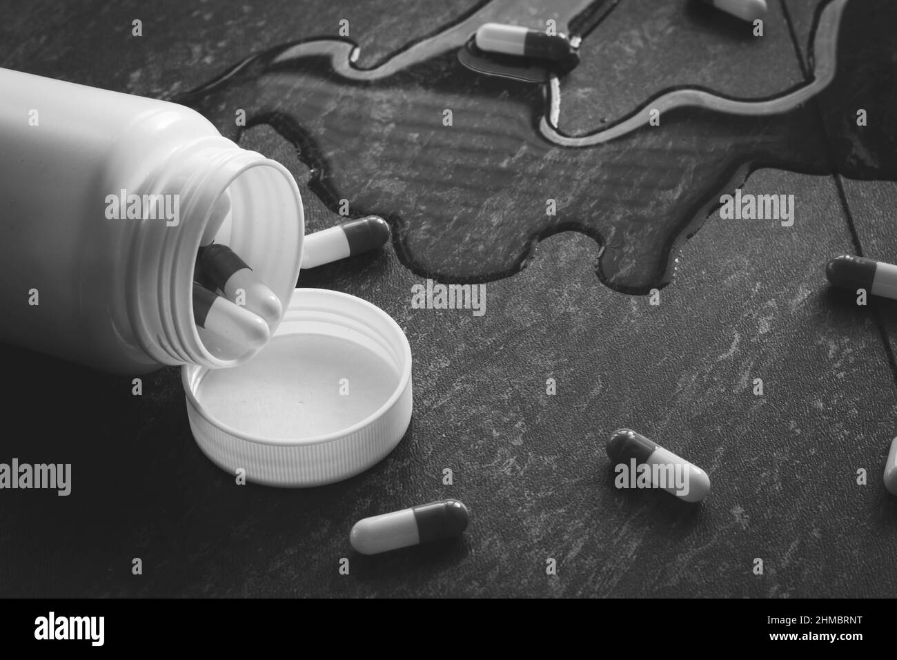 Tablets. Water is spilled and medical capsules are scattered. Ambulance ...