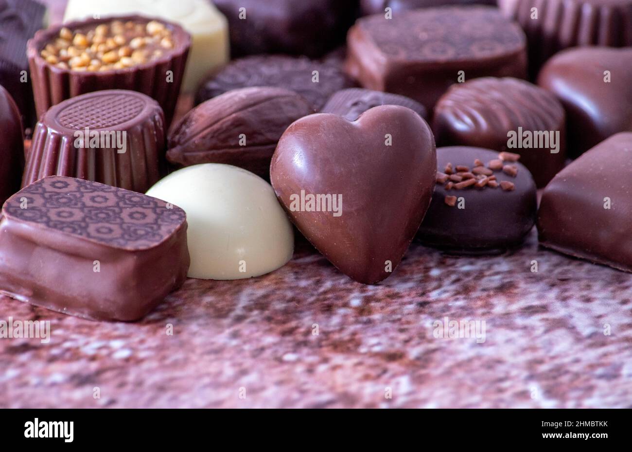 A chocolate heart is front and center in this delicious still life of ...