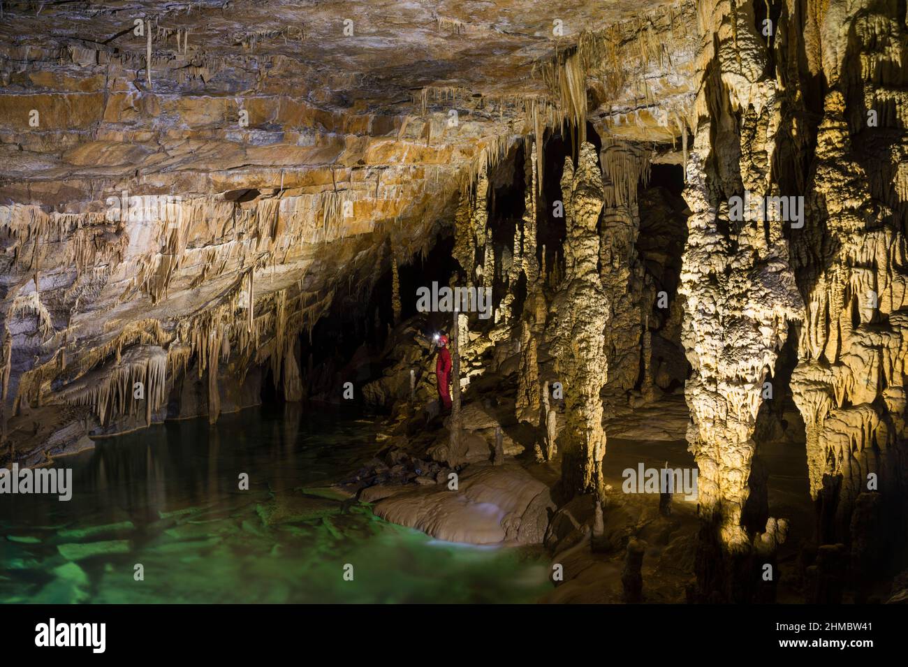 Cave scientist with a head lamp inside Krizna Jama Cave, Slovenia Stock ...