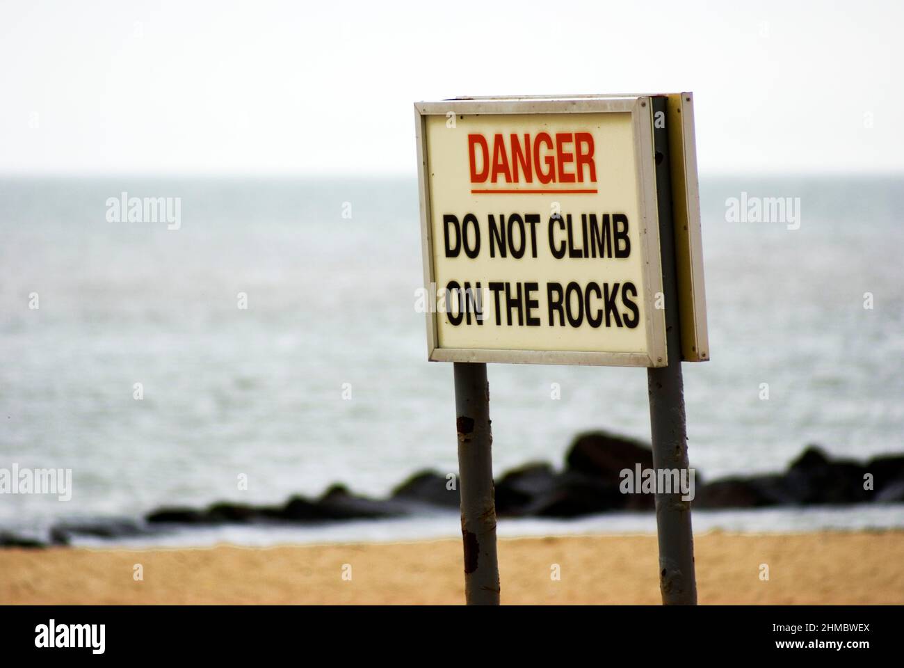 Rock climbing warning sign Stock Photo - Alamy