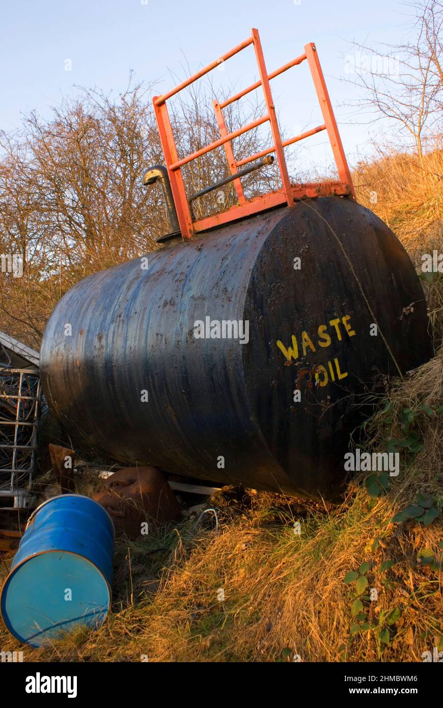 Waste oil tank at a scrapyard Stock Photo - Alamy