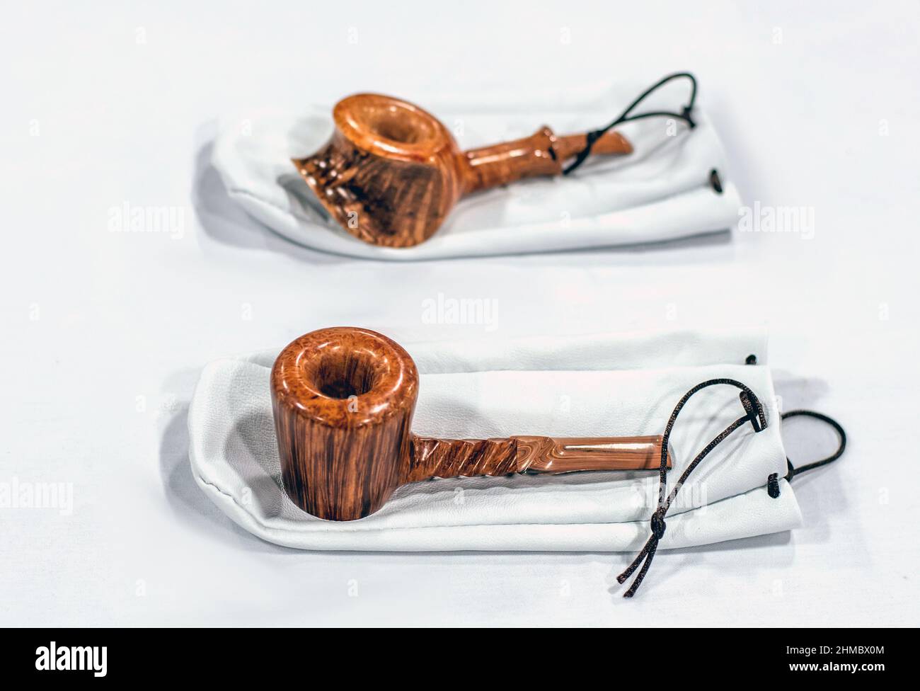 A pair of custom smoking pipes are called a poker pike and a freehand ...