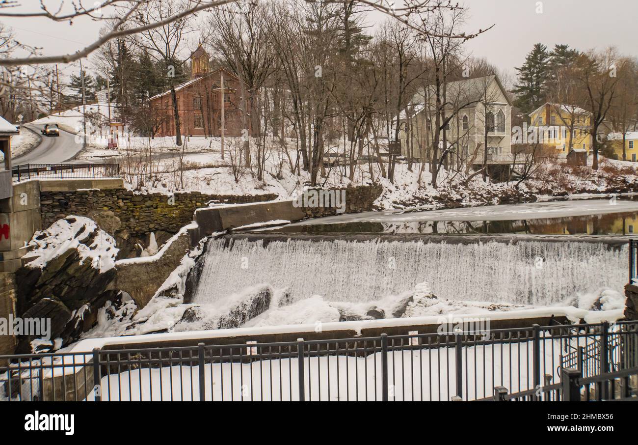 dam controlling the flow of icy water of the Ottauquechee River in ...