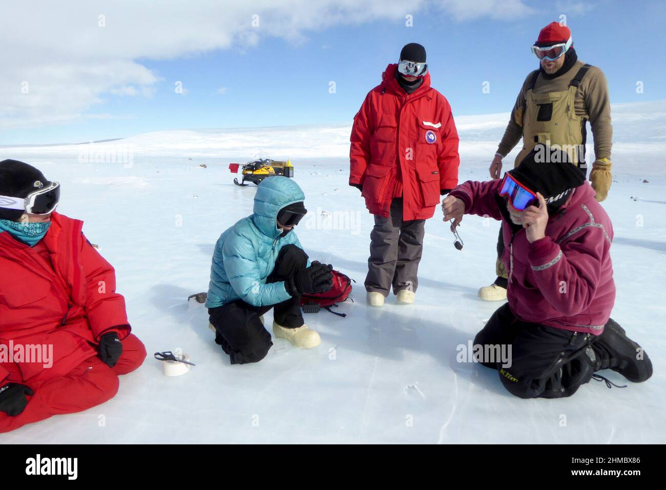 Mountaineer examining a meteorite Stock Photo - Alamy