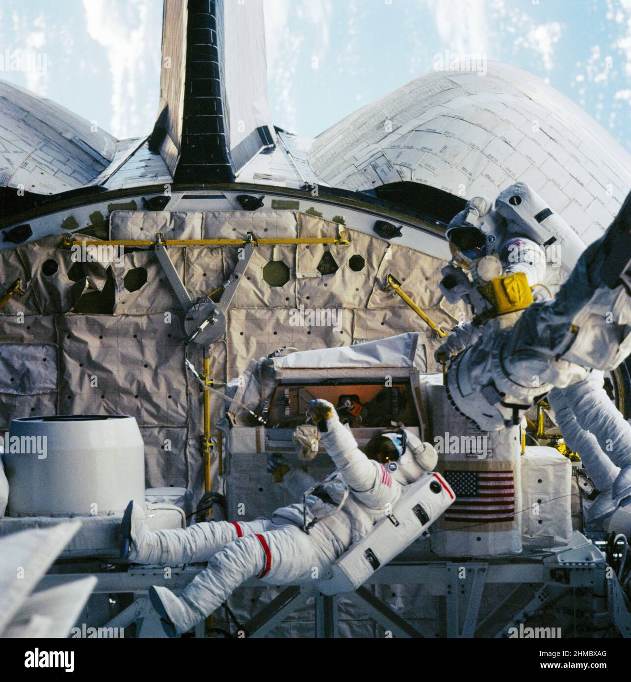Space shuttle astronauts on a spacewalk Stock Photo - Alamy