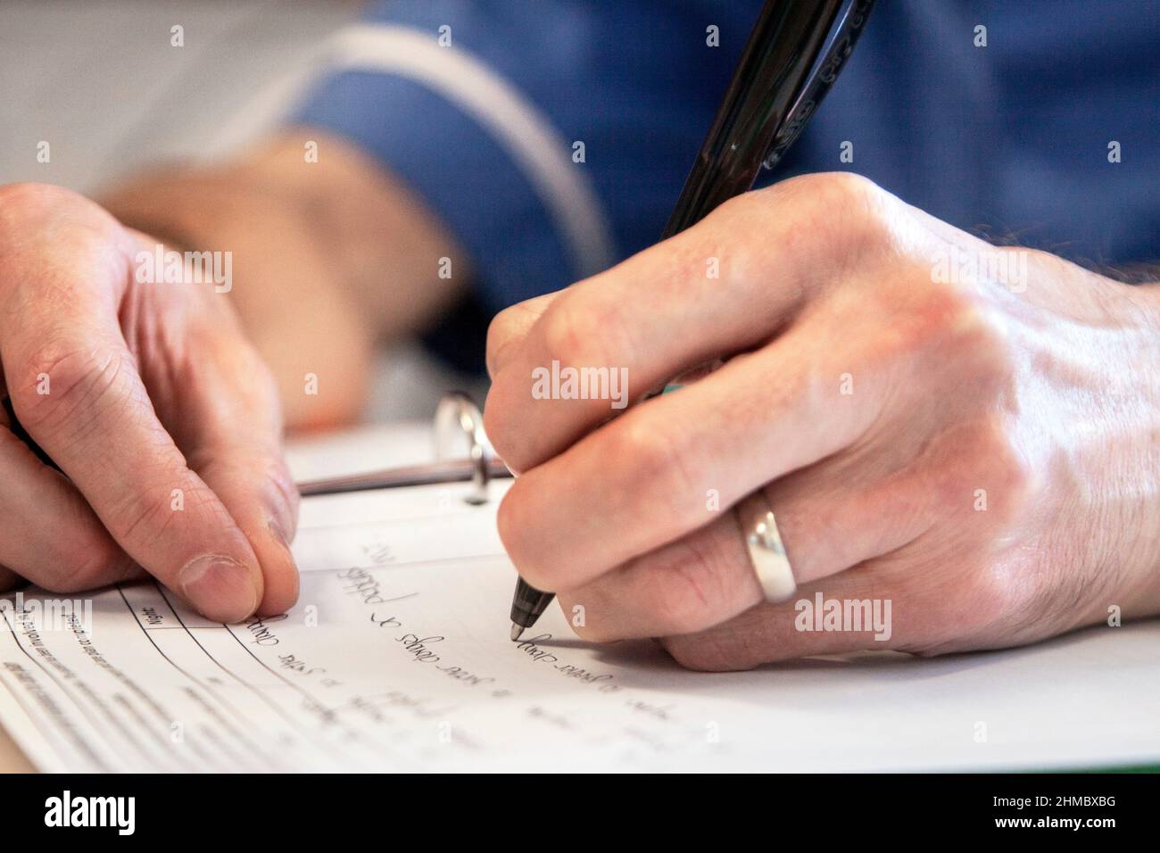 Nurse writing notes Stock Photo - Alamy