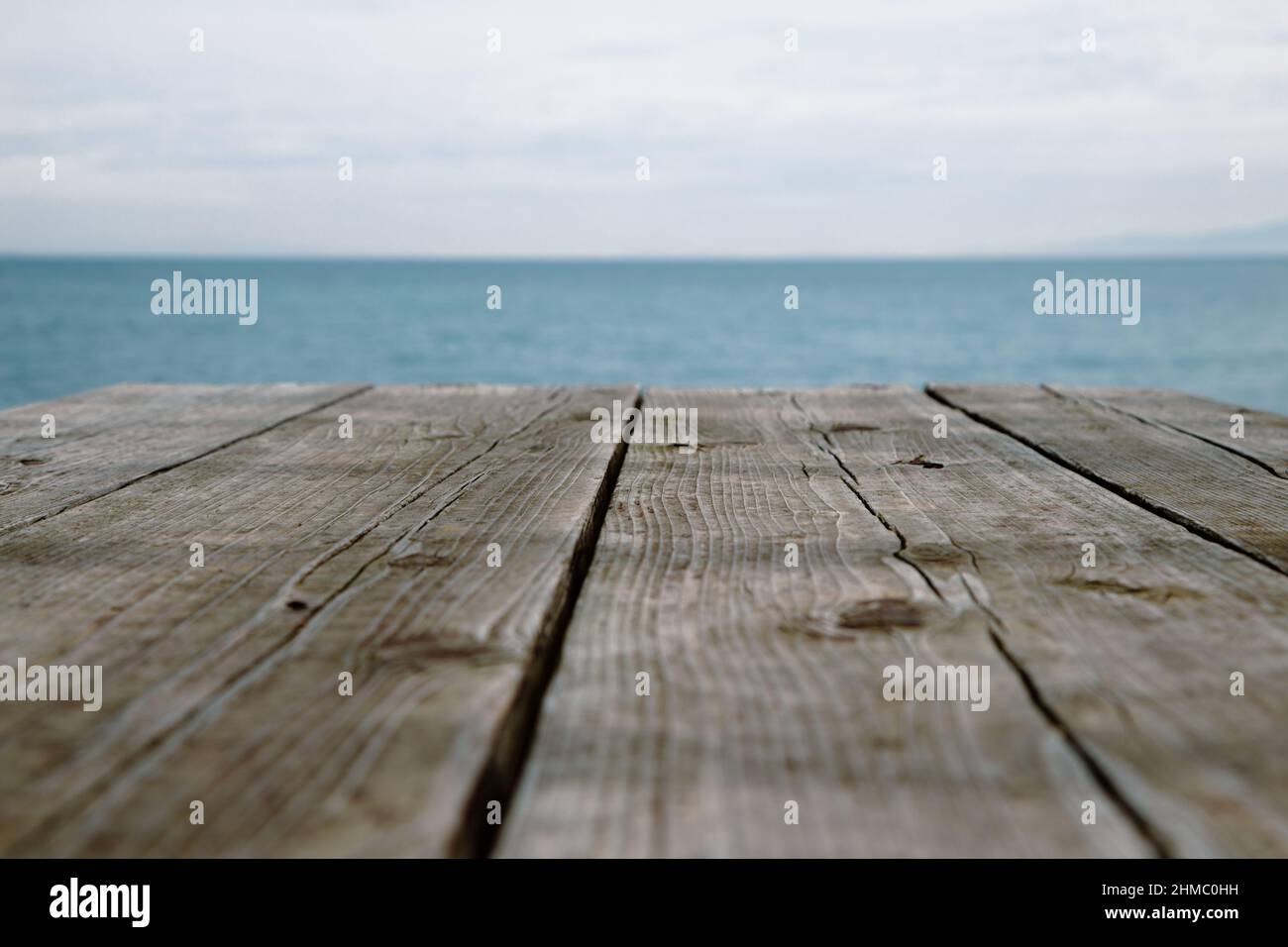 Blue beach and wooden table. abstract background Stock Photo - Alamy
