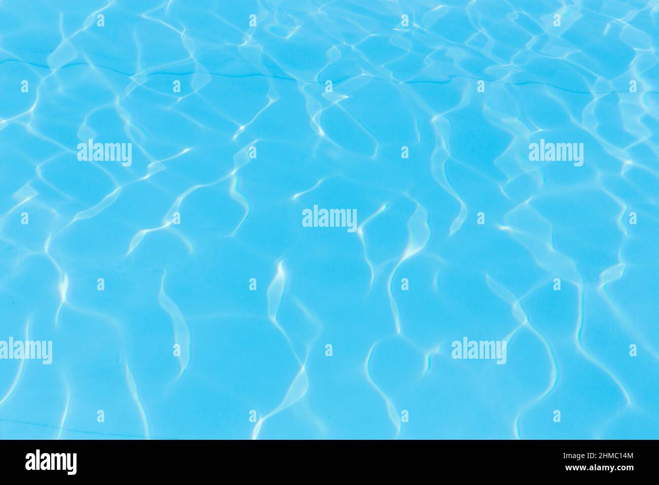 Blue pool water with sun reflections background Stock Photo - Alamy