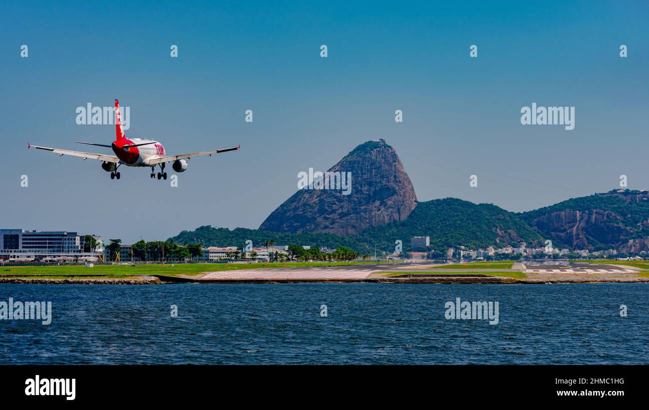 Rio de Janeiro, Brazil - CIRCA 2020: Commercial plane landing on the runway at Santos Dumont ...
