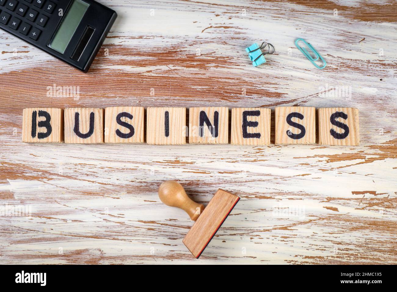 Business. Text from wooden alphabet blocks. calculator and stamp Stock ...