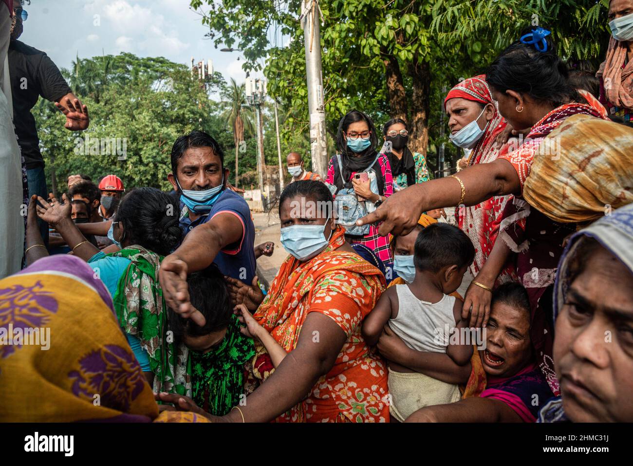 Poor people struggle to receive food support that a small local ...