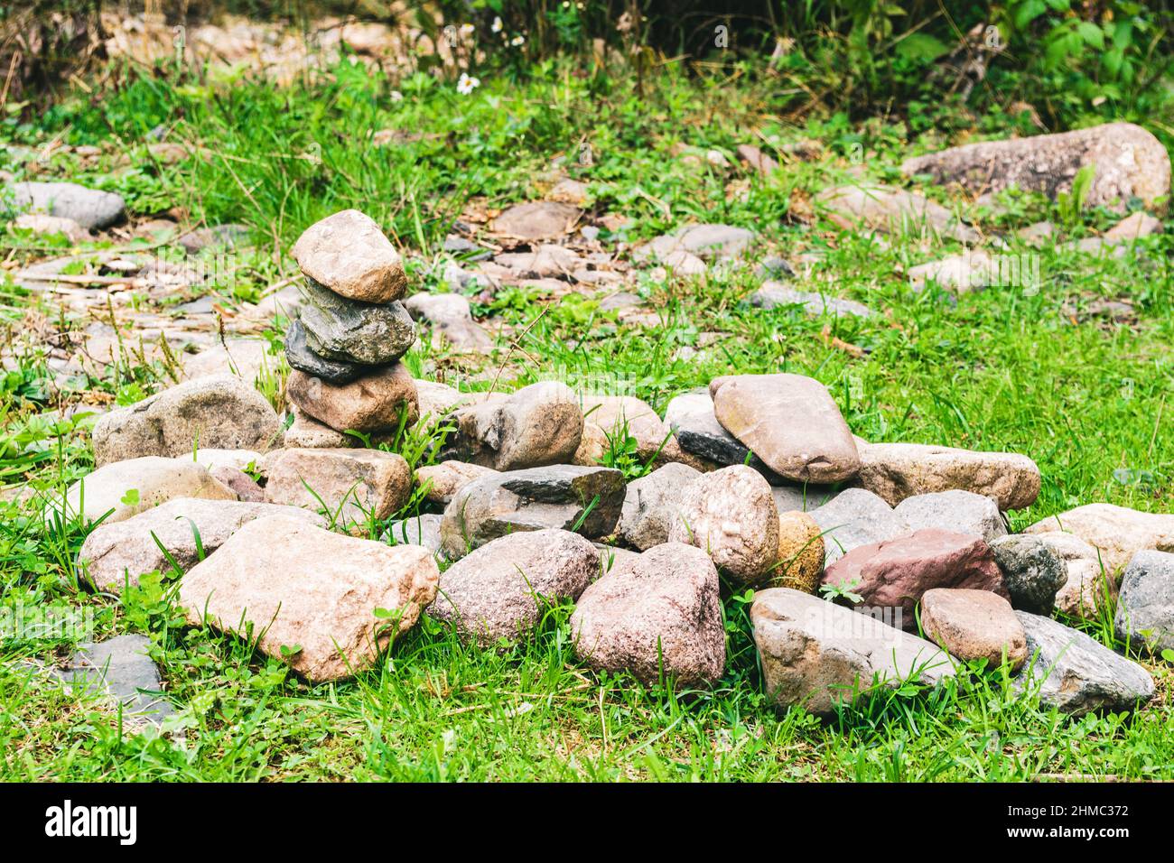 Rocks in different shapes and sizes on the grass in the field Stock ...