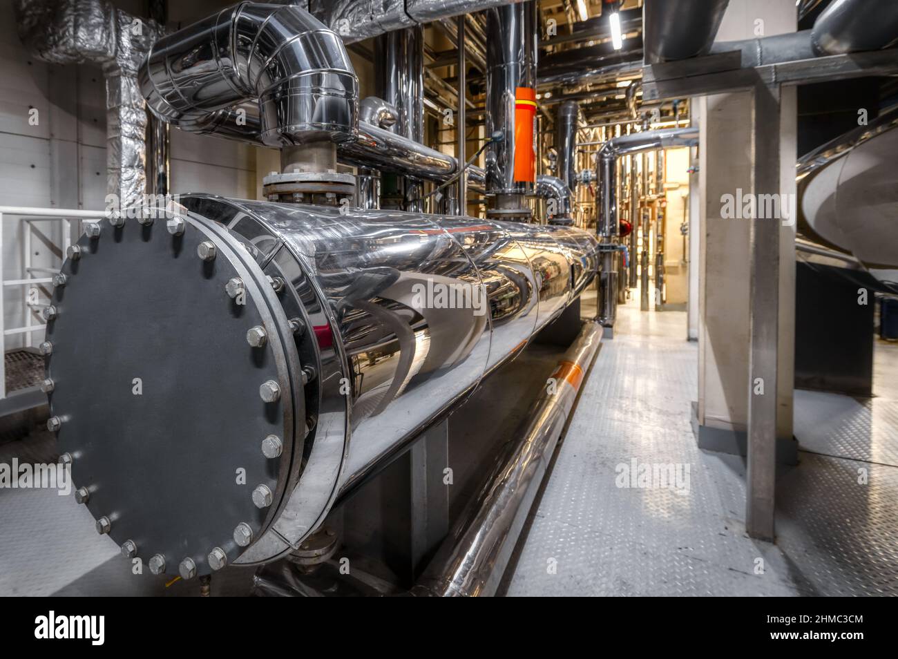 Cylindrical tank and pipeline system at production factory Stock Photo ...