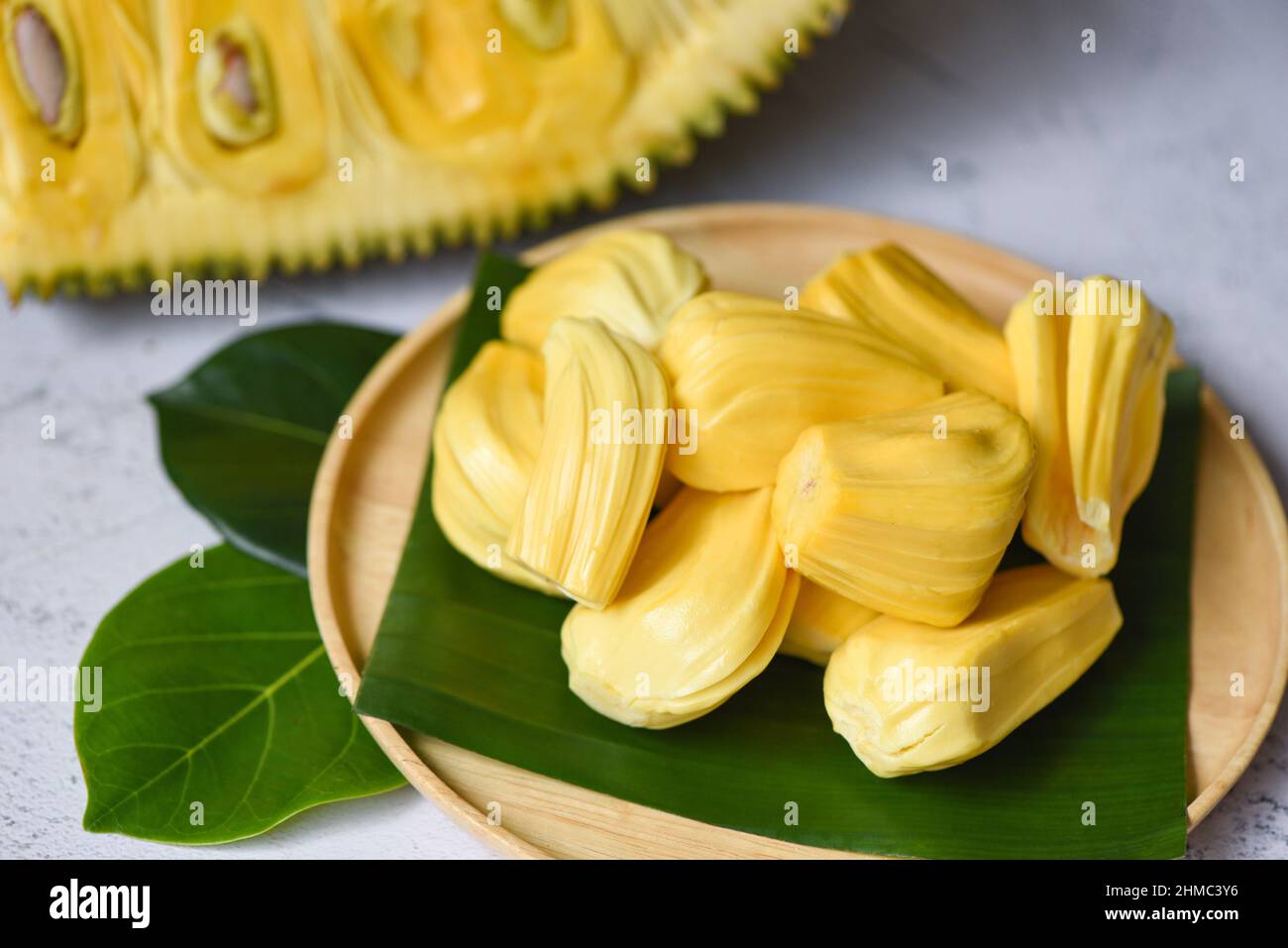 jackfruit on wooden plate with leaf, ripe jackfruit peeled tropical ...