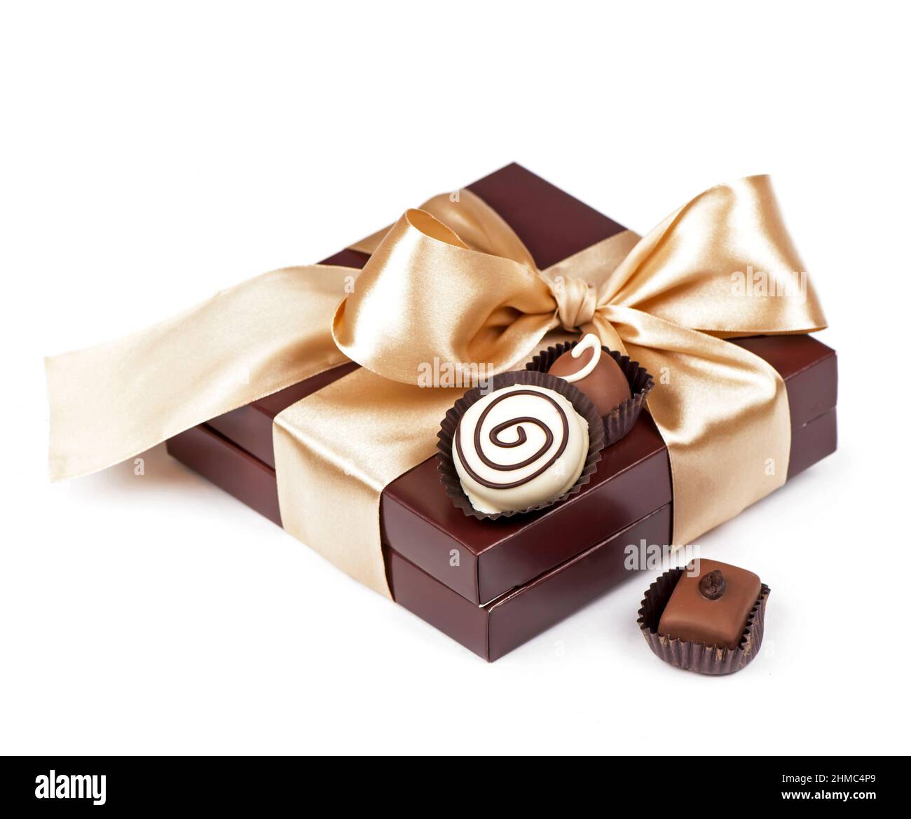 brown box with candies and golden tape isolated on the white Stock ...